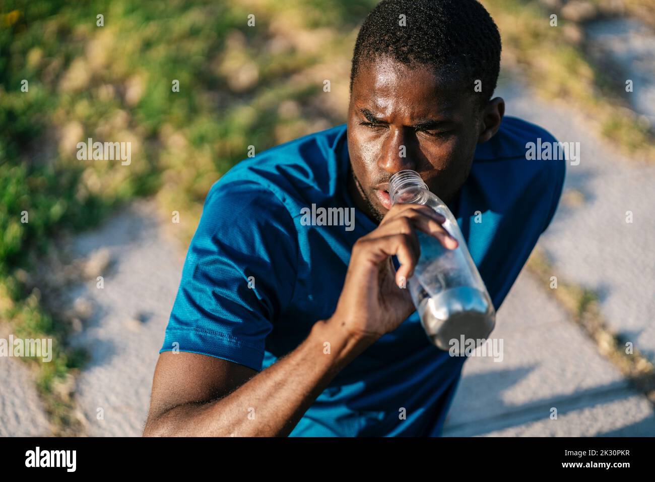 African man drinking from water hi-res stock photography and images - Alamy