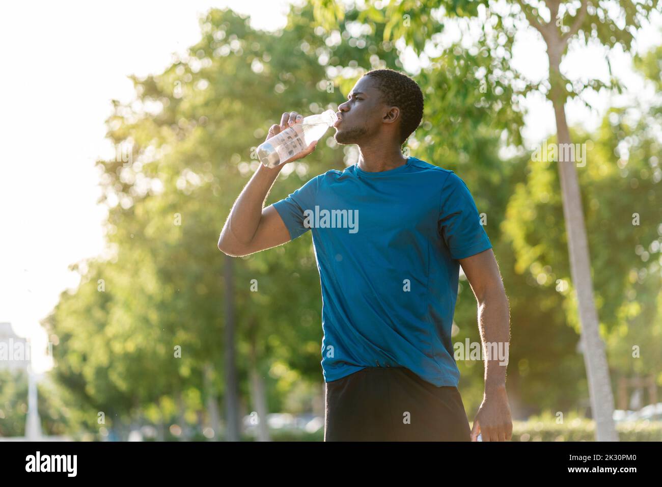 Sunny drinking water man hi-res stock photography and images - Alamy