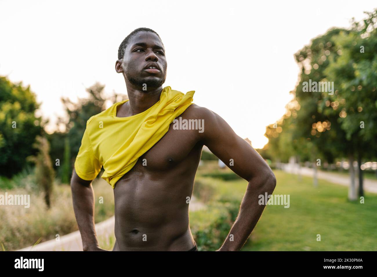 Male athlete hands on hips hi-res stock photography and images - Alamy