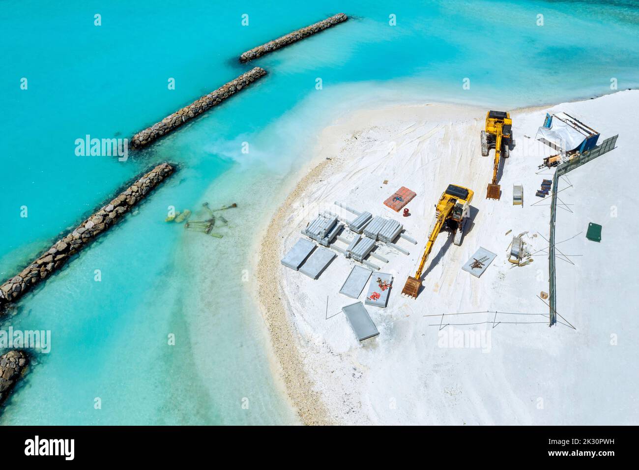 Maldives, Aerial view of construction site at edge of sandy beach Stock ...