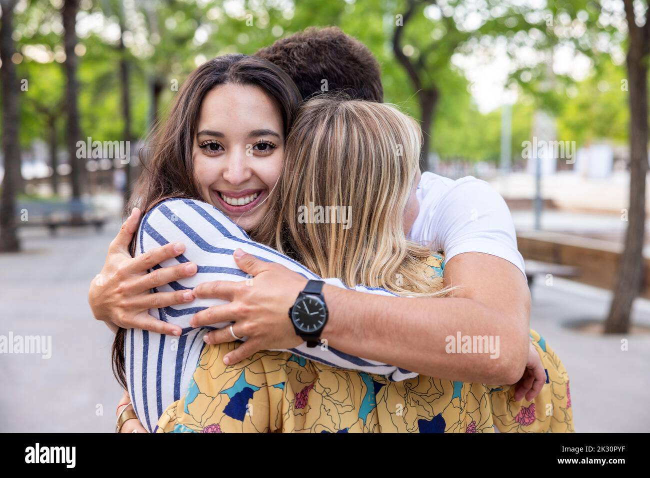 Hugging friends hi-res stock photography and images - Alamy