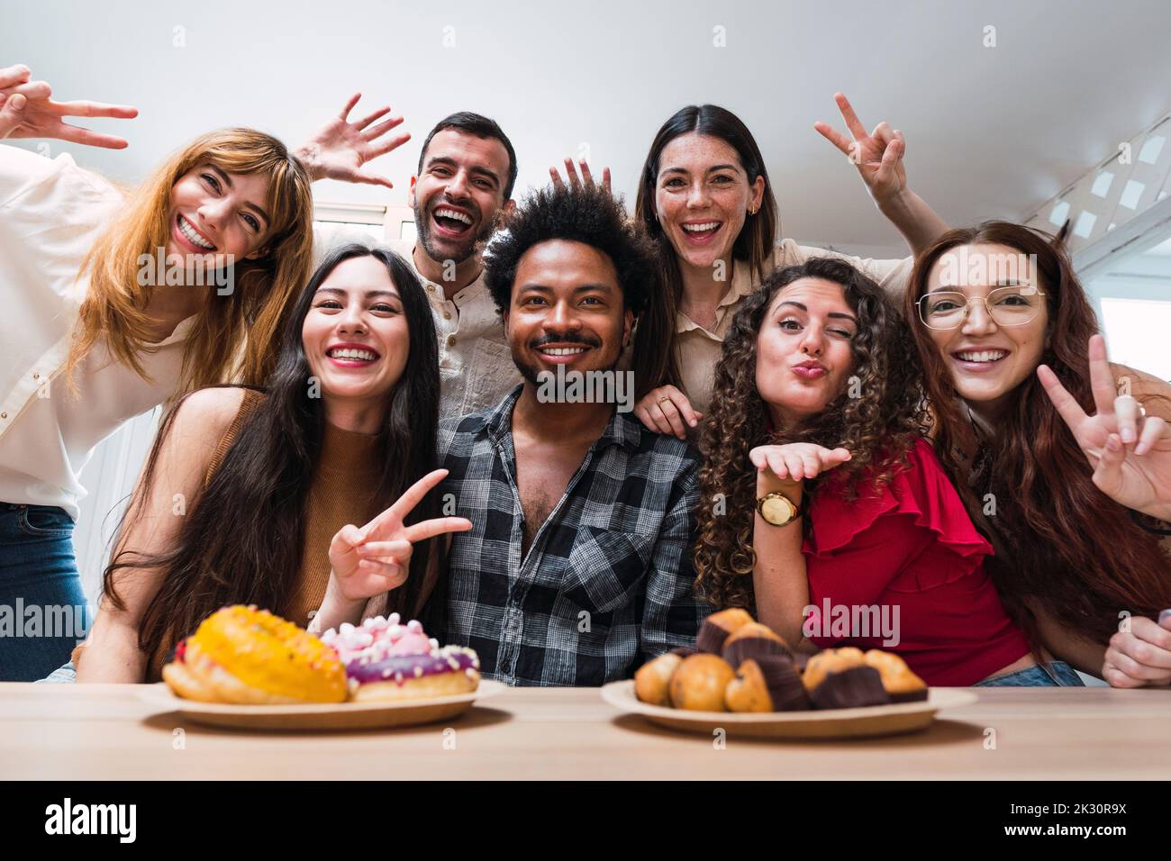 Happy multiracial business colleague enjoying together gesturing in ...