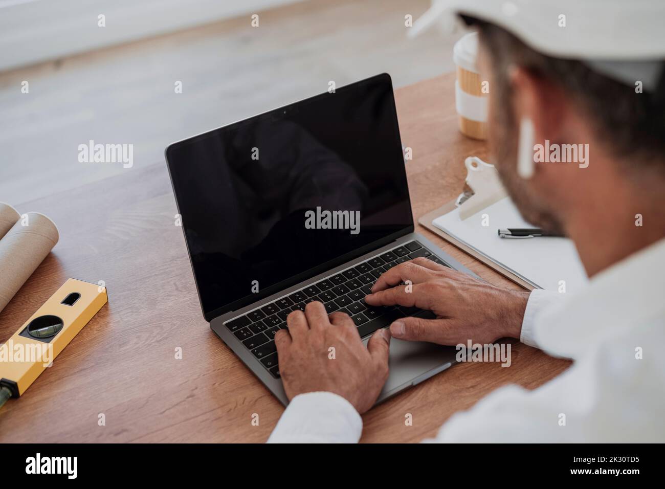 Over the shoulder man using laptop hi-res stock photography and images ...