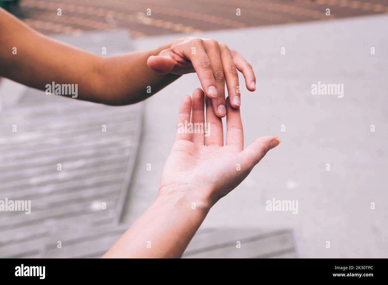Friends touching fingers their hands hi-res stock photography and ...