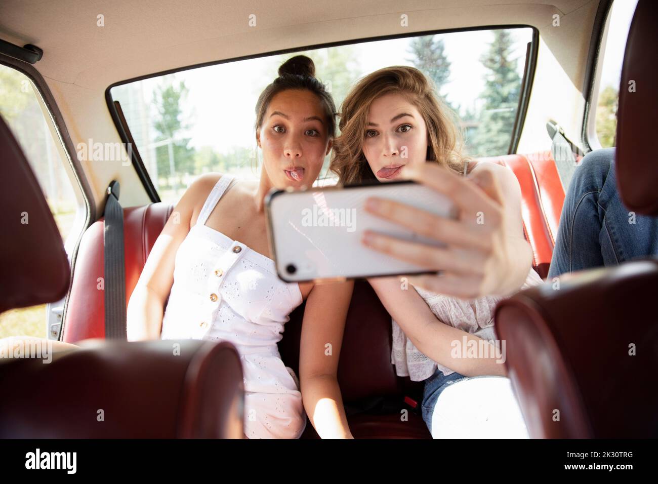 Teen girl in car backseat hi-res stock photography and images - Alamy