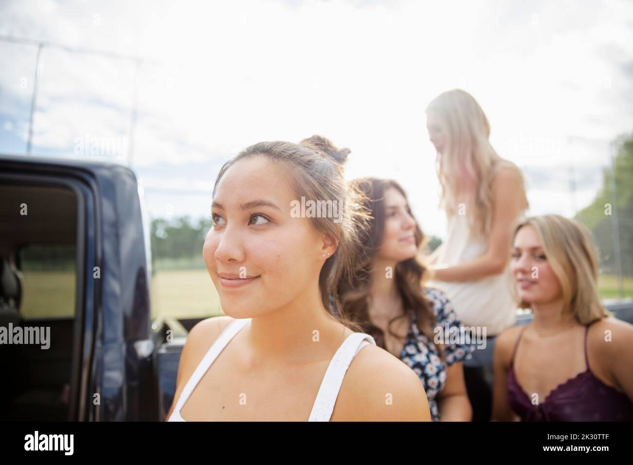 Beautiful teenage girl hanging out with friends Stock Photo - Alamy
