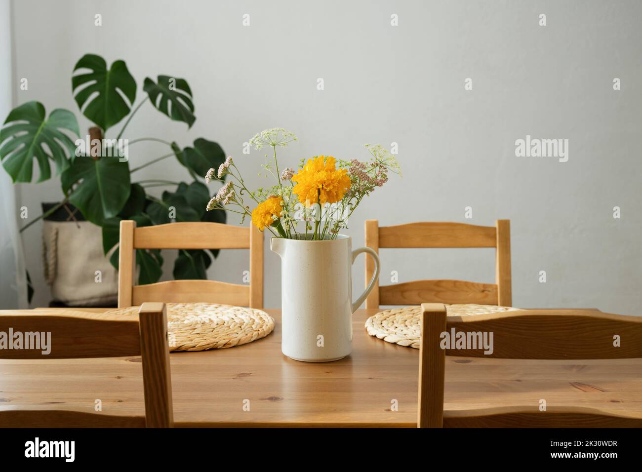 Flower vase on dining table Stock Photo - Alamy