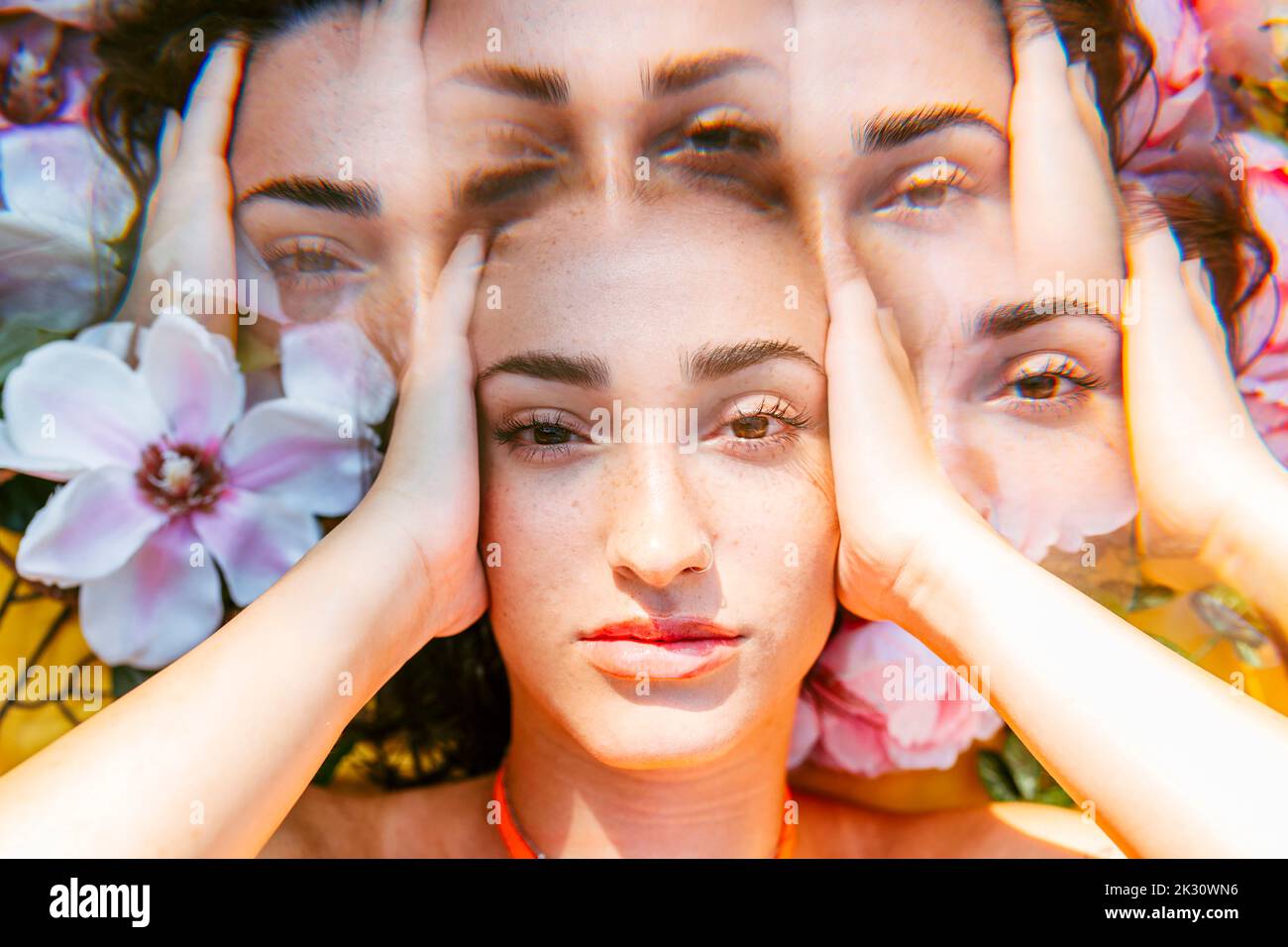 Multiple exposure of young woman with head in hands Stock Photo - Alamy