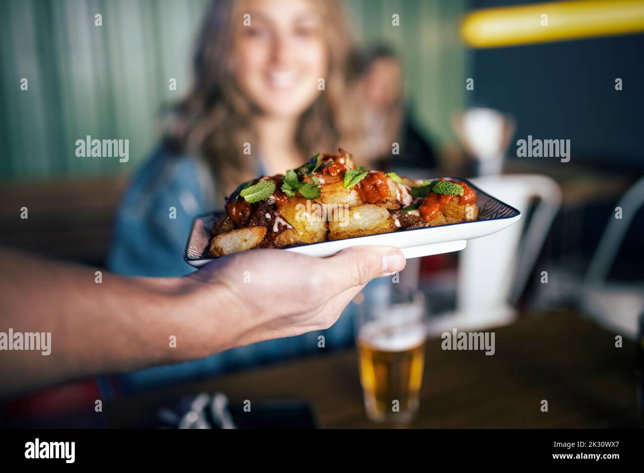 Waiter serving food restaurant hi-res stock photography and images - Alamy