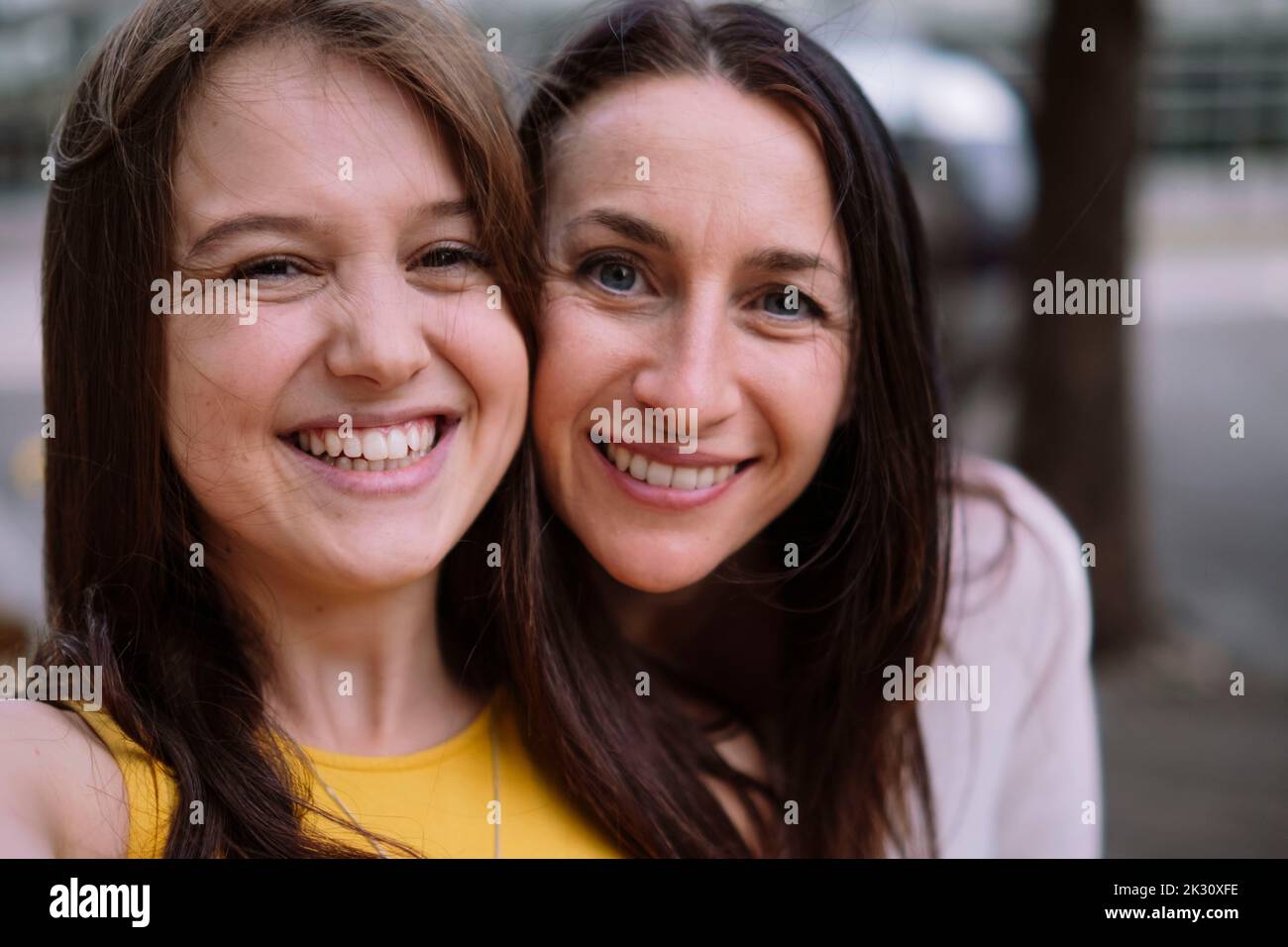 Cheerful women standing together having fun Stock Photo - Alamy