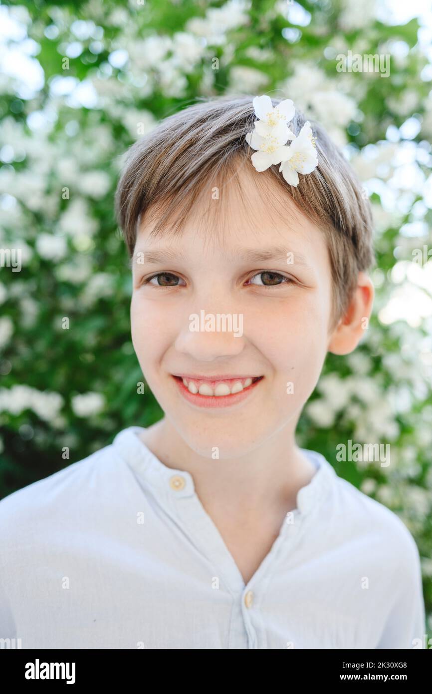 Happy boy with jasmine flower in hair Stock Photo - Alamy