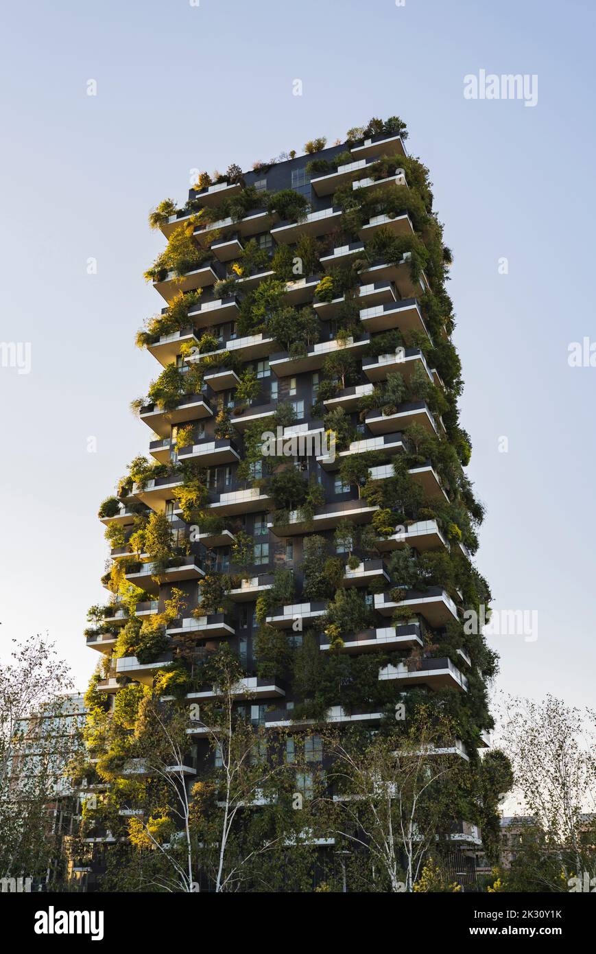 Tall modern building with vertical garden in front of sky Stock Photo ...