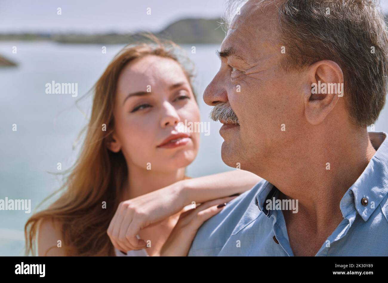 Contemplative senior man standing by daughter Stock Photo - Alamy Contemplative senior man standing by daughter Stock Photo - Alamy
