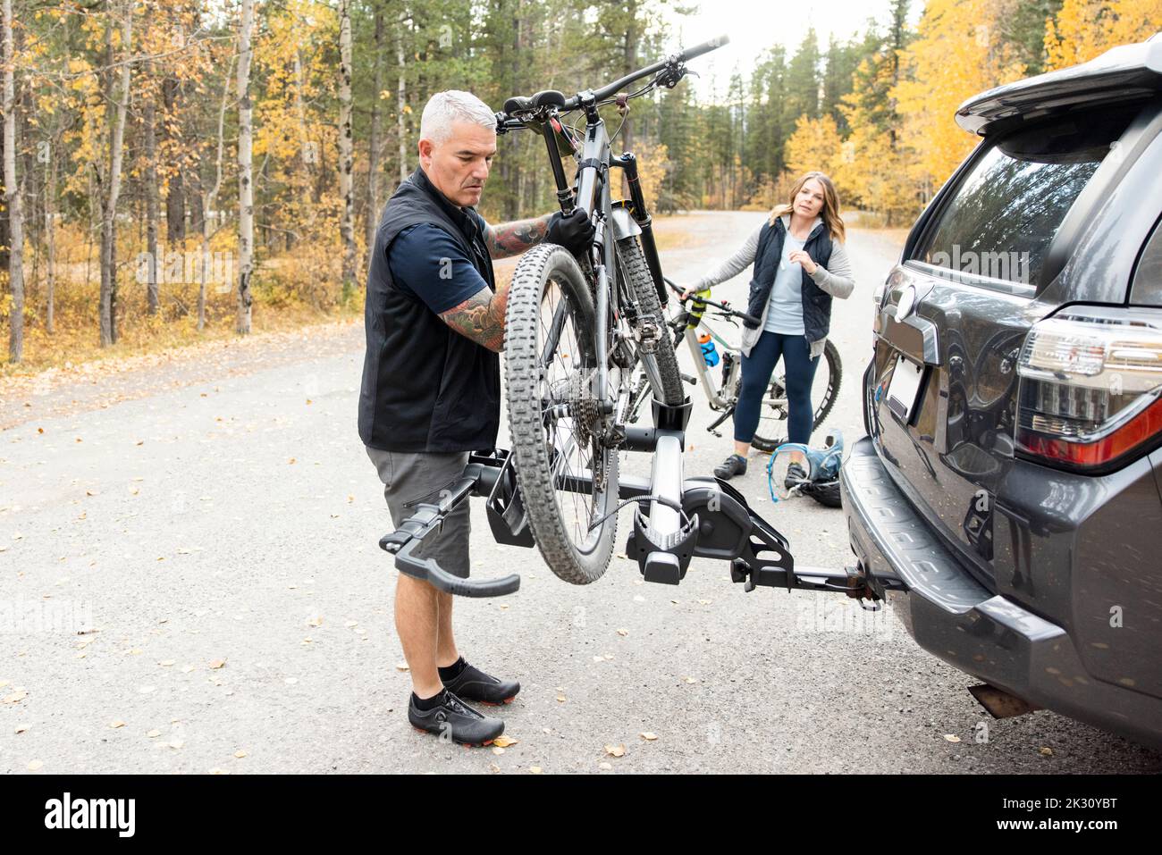 Loading his bicycle hi-res stock photography and images - Alamy