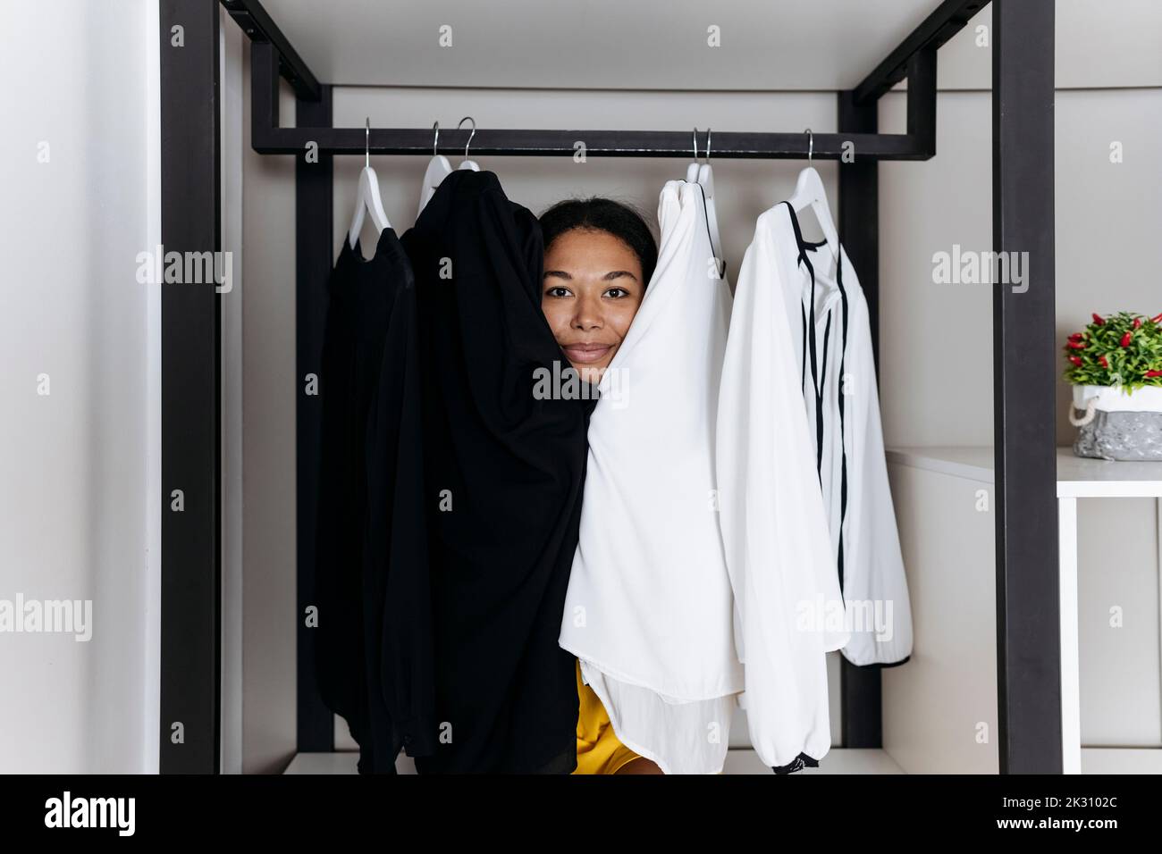 Woman looking inside wardrobe hi-res stock photography and images - Alamy