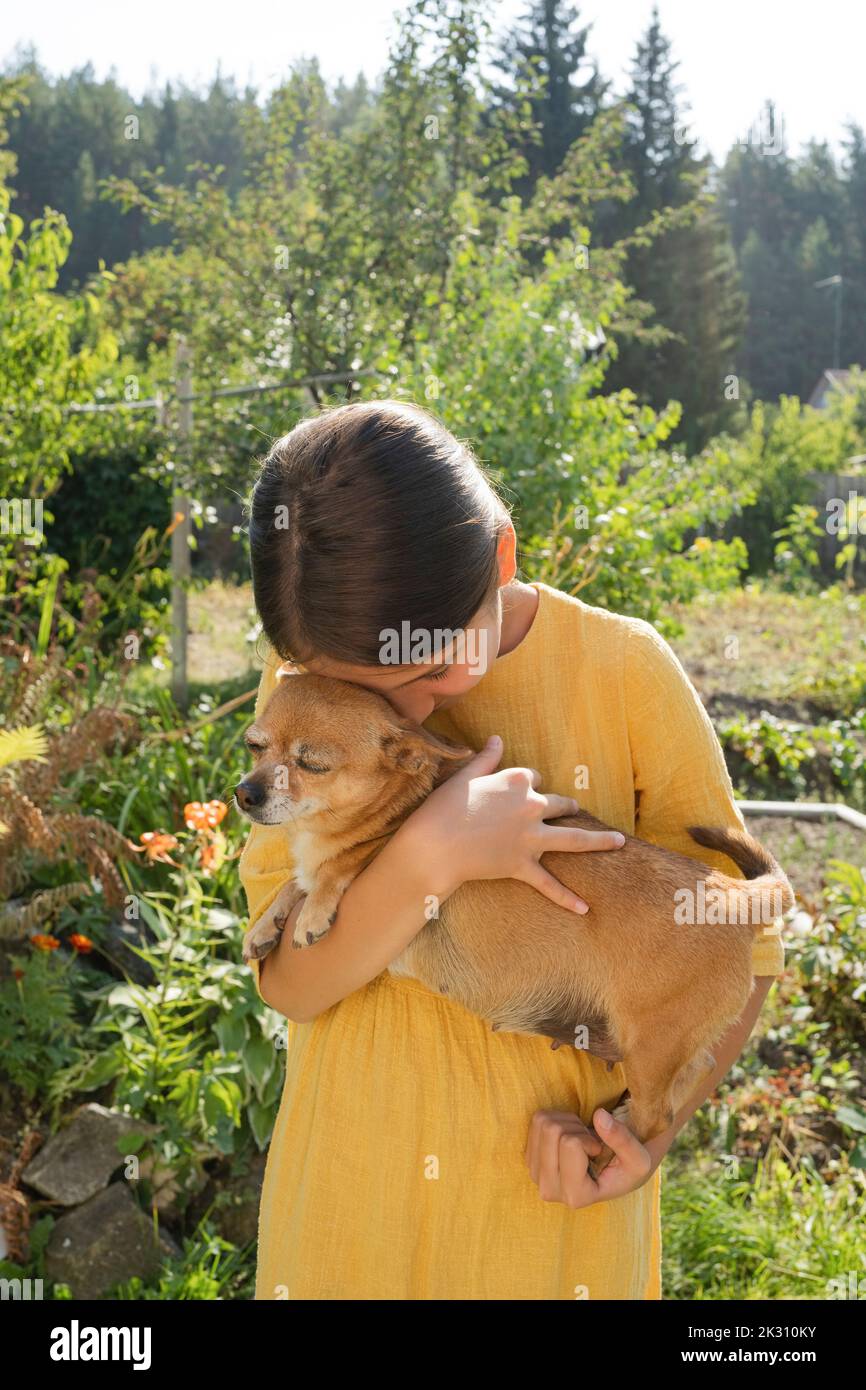 Child embracing dog hi-res stock photography and images - Alamy