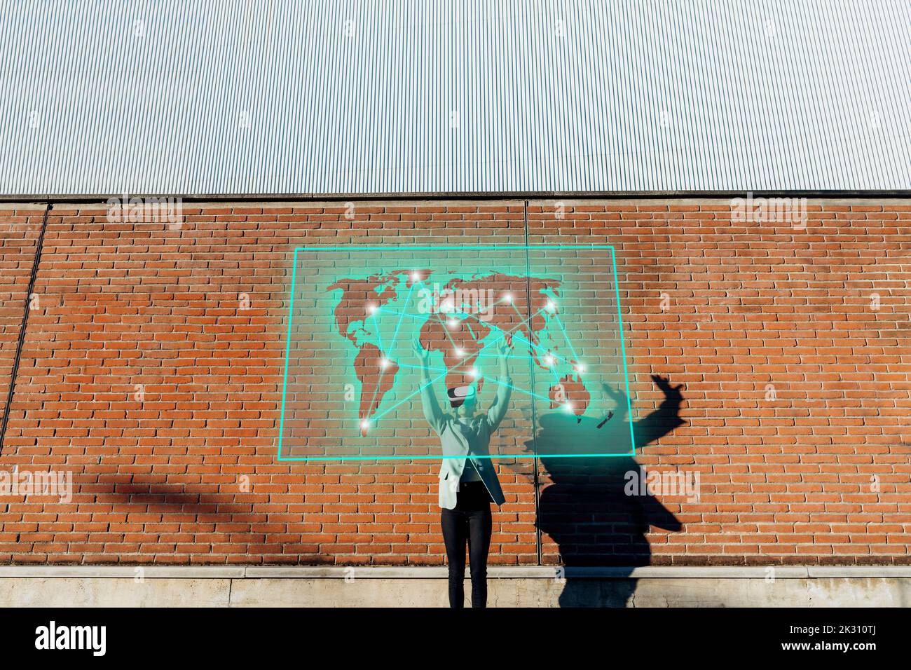 Businesswoman with VR glasses touching projection screen in front of ...