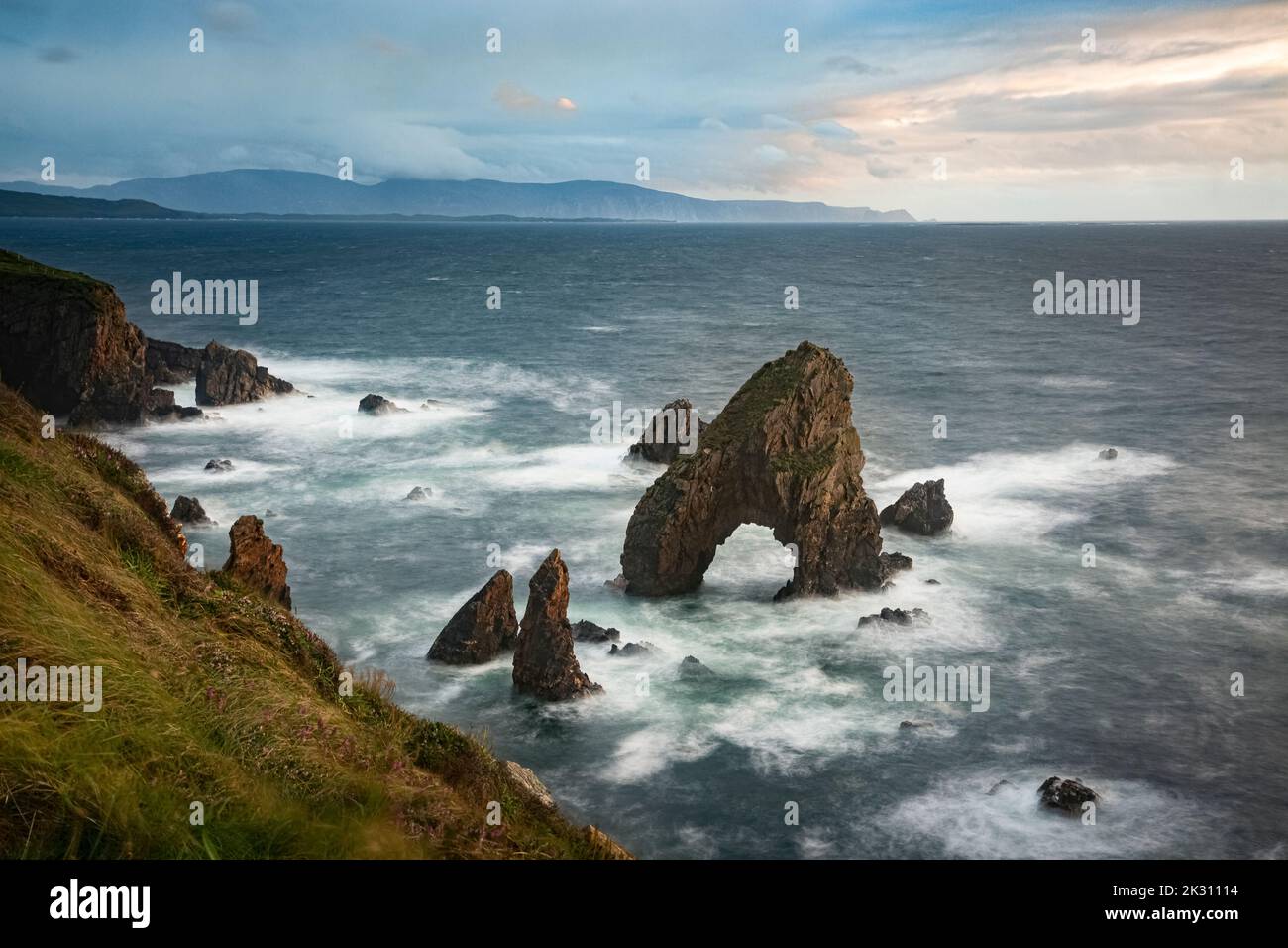 Famous Crohy Head Sea Arch in sea at sunset, County Donegal, Ireland ...
