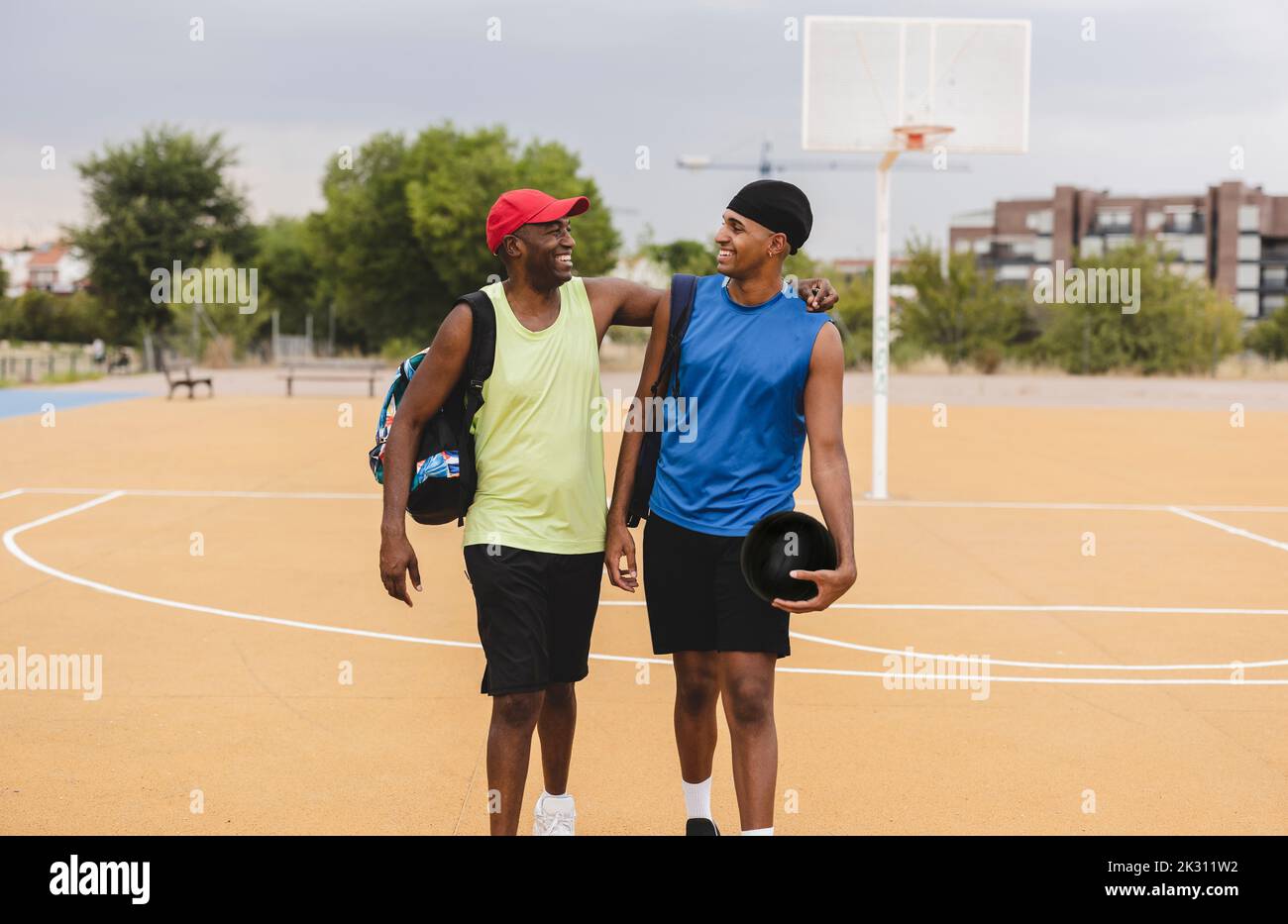 Young male basketball player walking hi-res stock photography and ...