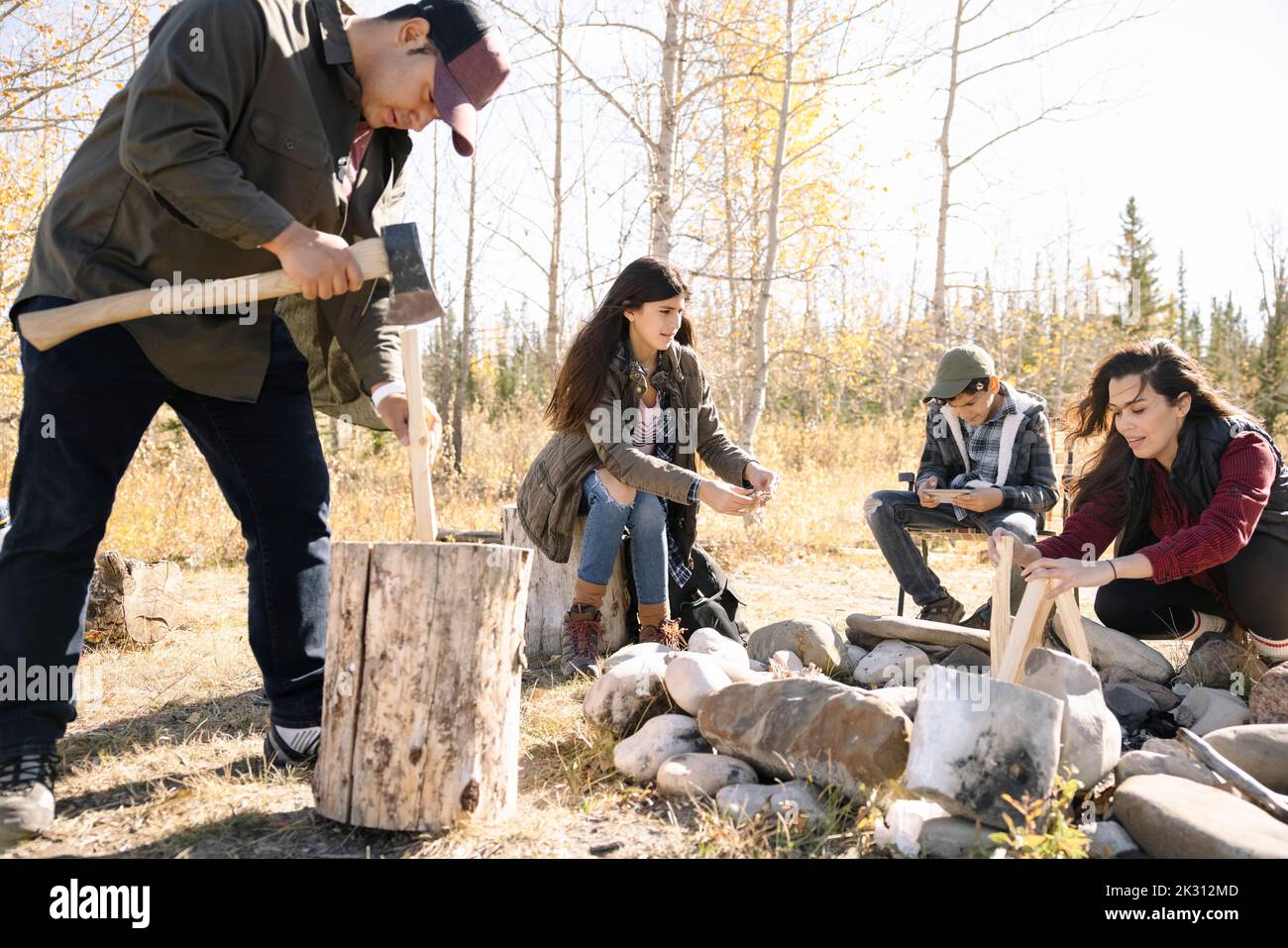 Family building campfire in forest hi-res stock photography and images ... Family building campfire in forest hi-res stock photography and images ...