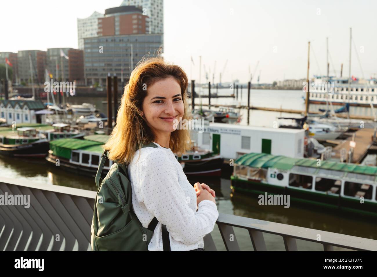 Smiling woman standing port hamburg hi-res stock photography and images ...