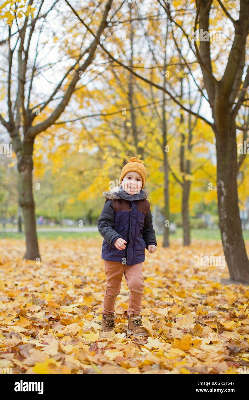 Boy playing in park hi-res stock photography and images - Alamy