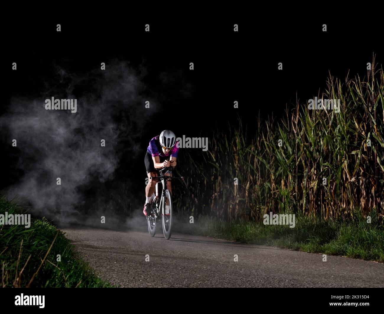 Triathlete training on road bicycle hi-res stock photography and images ...