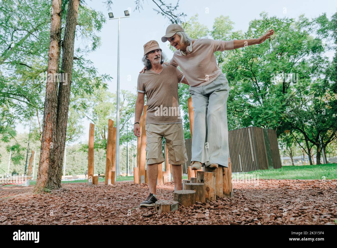 Woman supporting young man outdoors hi-res stock photography and images ...