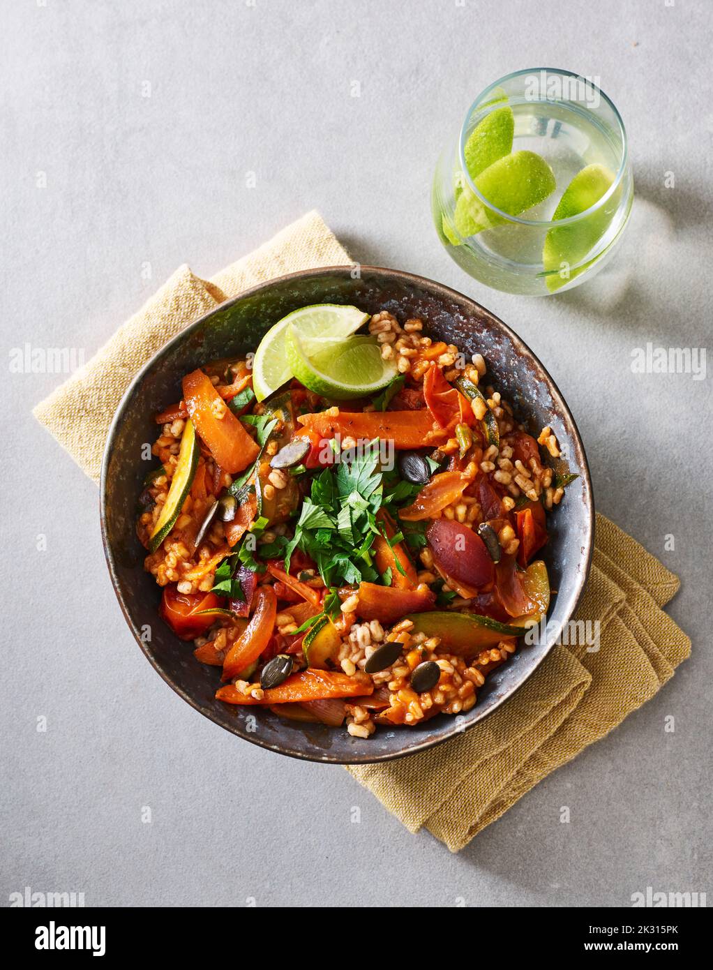 Ready-to-eat bowl of cooked grains with vegetables, pumpkin seeds ...