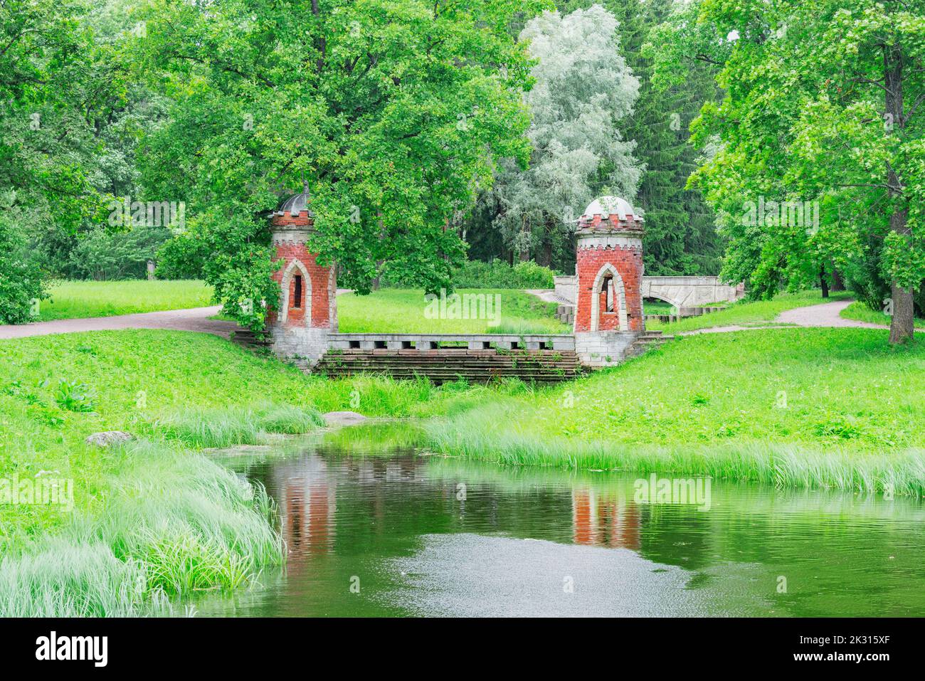 Stone bridges over the pond in the summer city park Stock Photo - Alamy