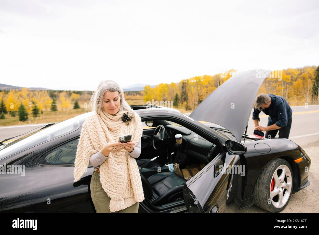 Woman on car hood hi-res stock photography and images - Alamy