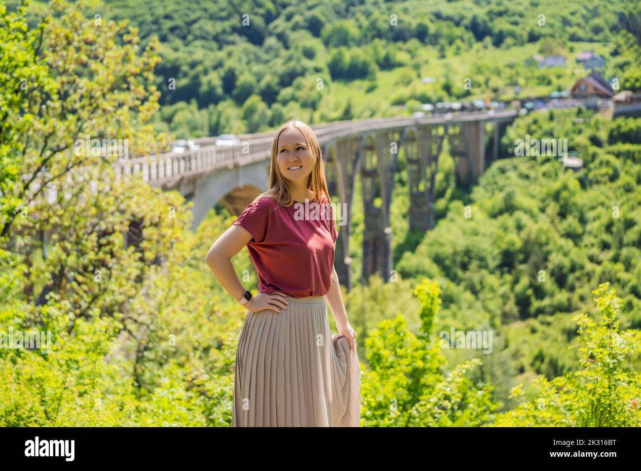 Montenegro. Woman tourist in background of Dzhurdzhevich Bridge Over ...