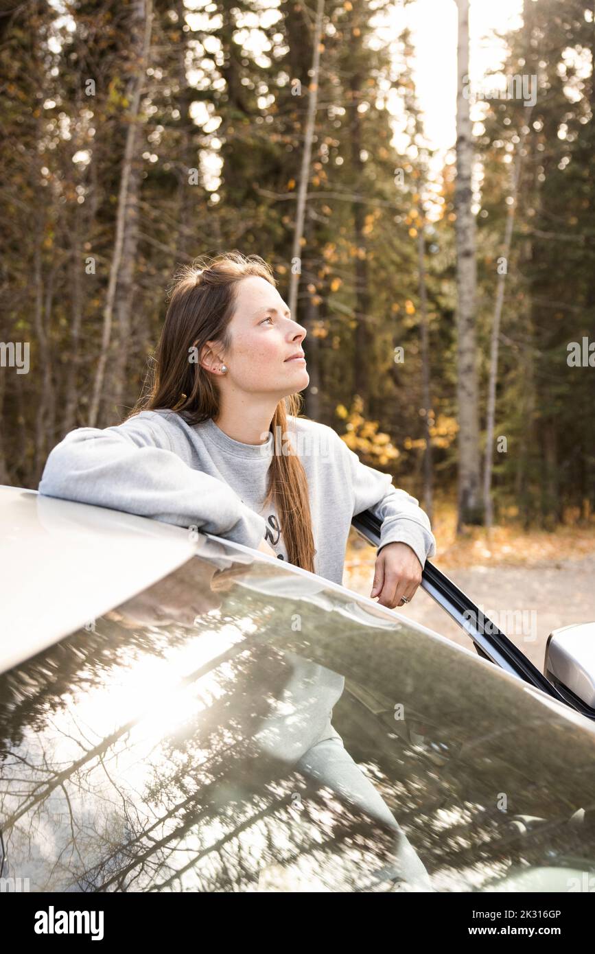 Woman on car roof hi-res stock photography and images - Alamy