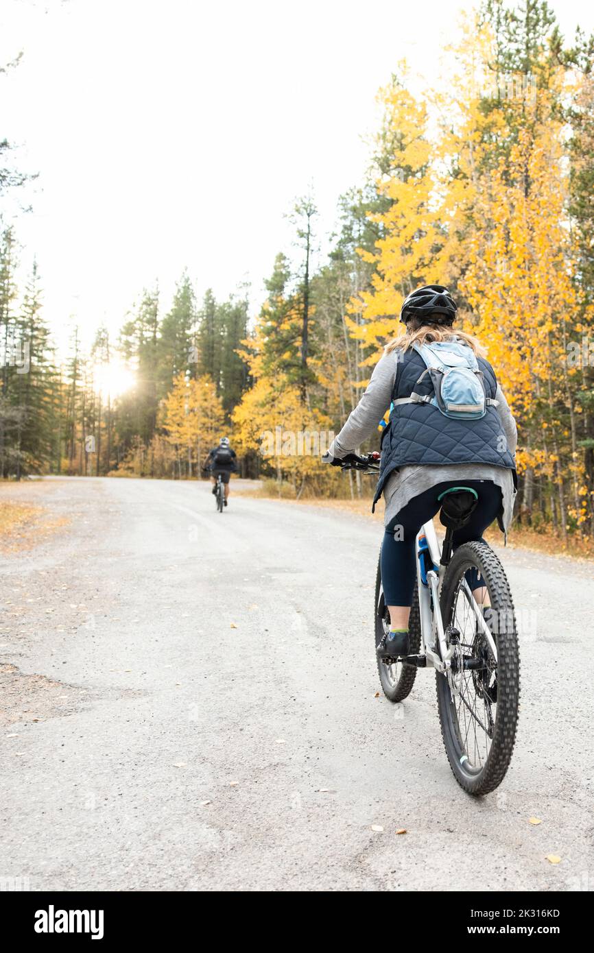 Woman riding bike hi-res stock photography and images - Alamy