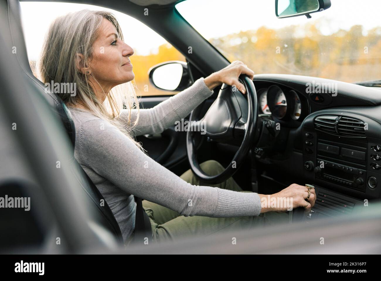 Woman driving sports car alone hi-res stock photography and images - Alamy