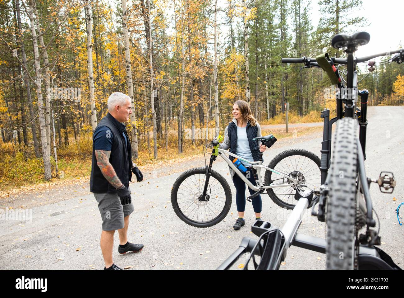 Loading his bicycle hi-res stock photography and images - Alamy