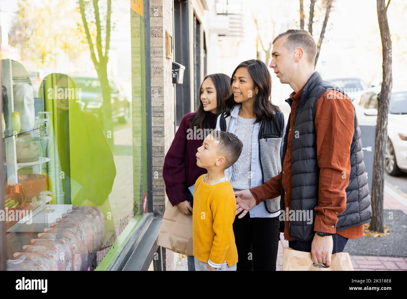 Family and window hi-res stock photography and images - Alamy