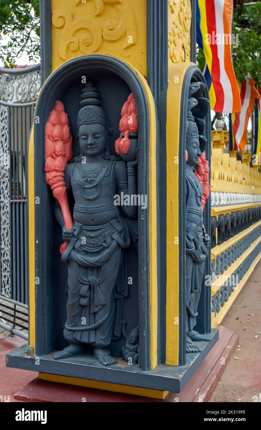 Statues of a goddess on the main entrance gates leading into the Ruhunu ...