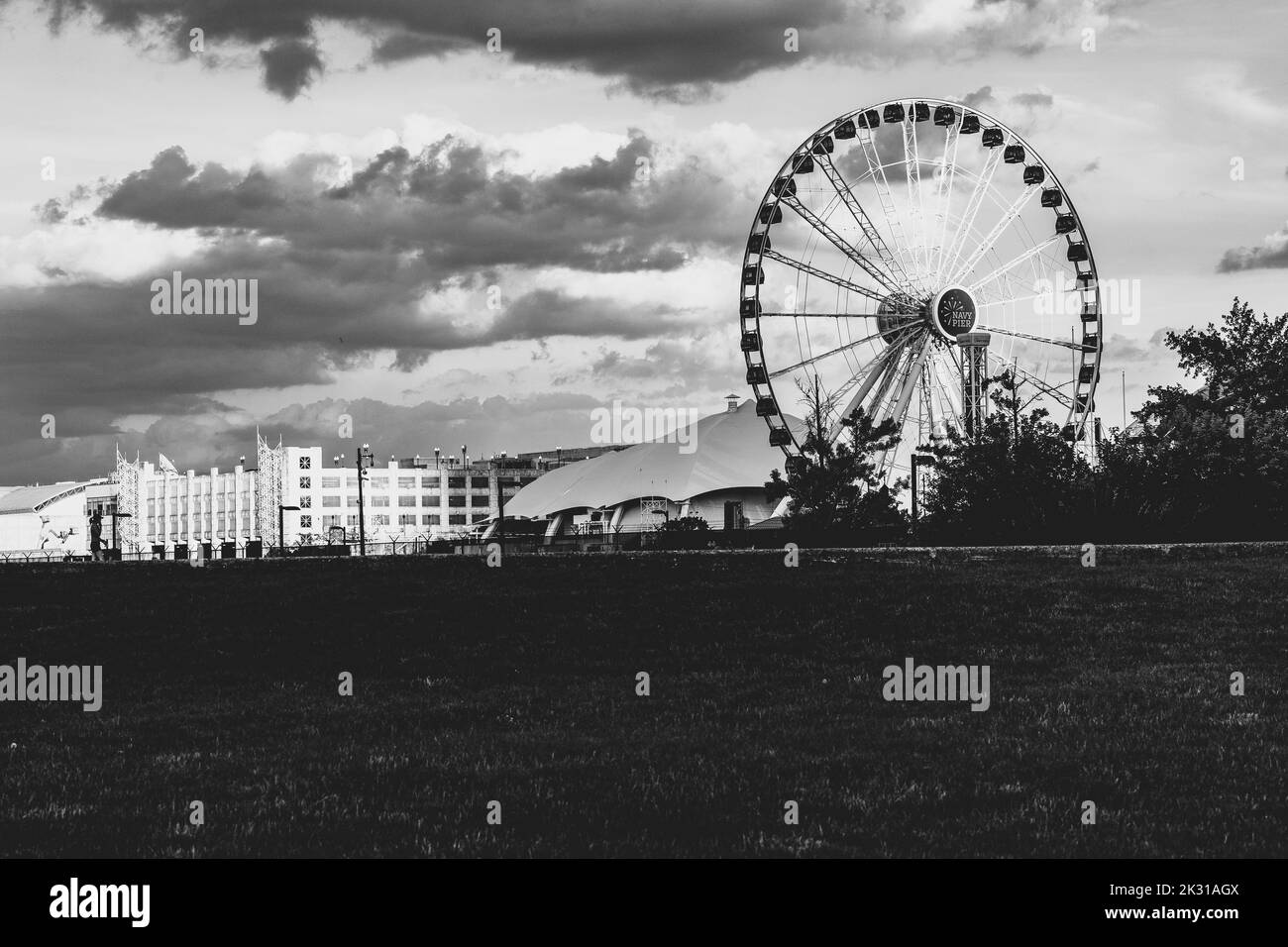 A scenic view of a Ferris wheel in downtown Chicago in a black and ...