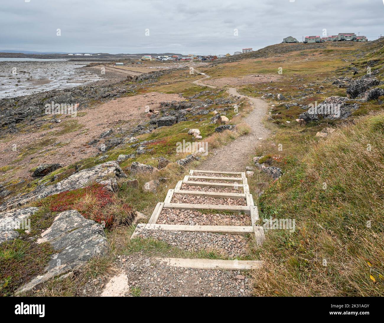 Footpath along the Arctic Ocean with the outskirts of Iqaluit, Nunavut ...