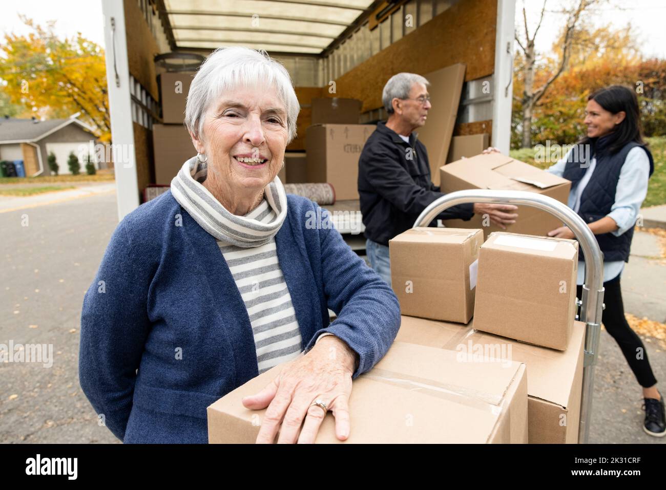 Senior woman moving home hi-res stock photography and images - Alamy
