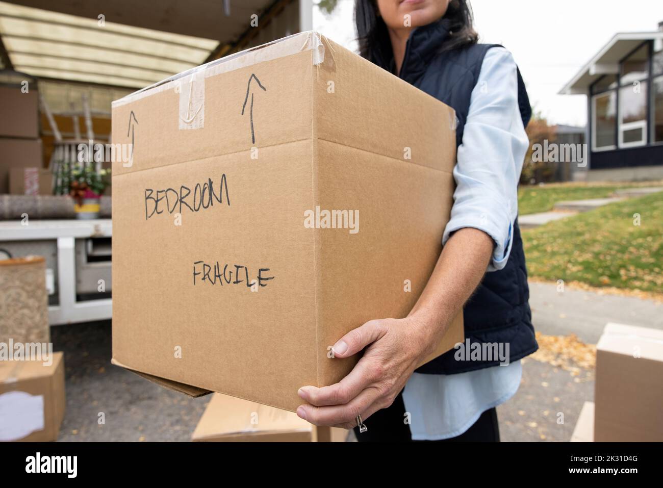 Woman carry box hi-res stock photography and images - Alamy