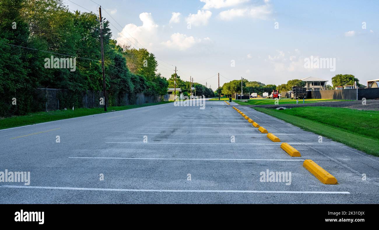 Parking lot near county side with tree near by Stock Photo - Alamy