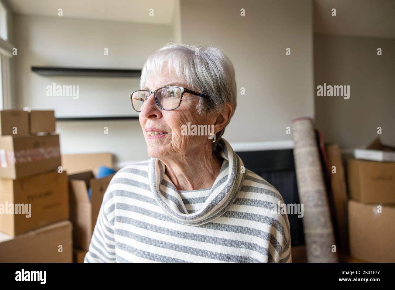 Senior woman moving home hi-res stock photography and images - Alamy