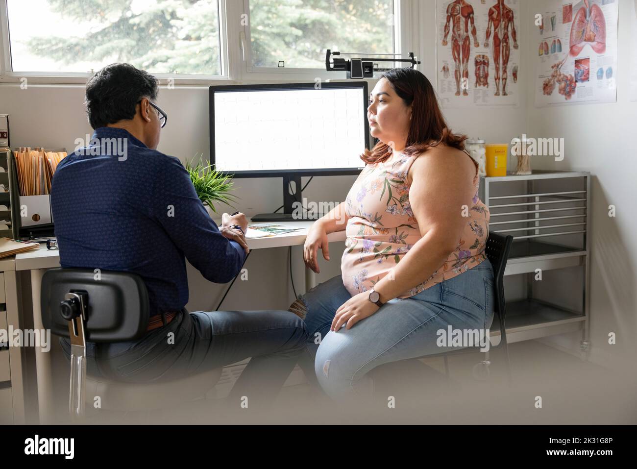 Doctor talk overweight hi-res stock photography and images - Alamy