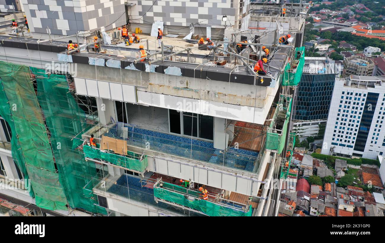 Java, Jakarta, Indonesia, May 20, 2022. Workers are using gondola as ...
