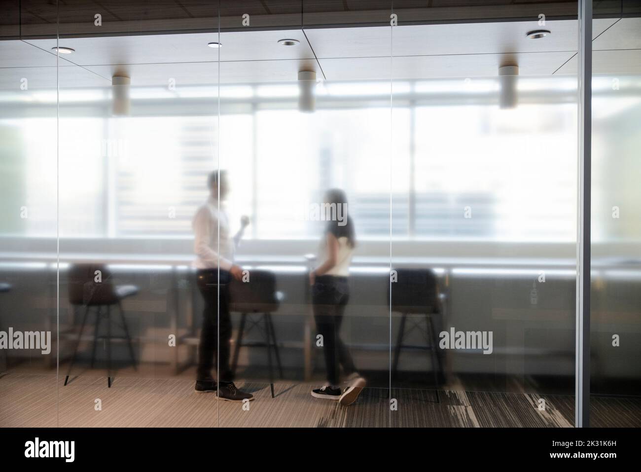Businessman standing behind glass hi-res stock photography and images ...