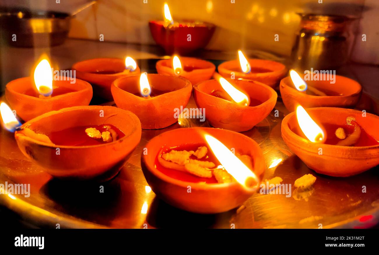 A closup of Diya lamp with fire. Traditional Diwali festival Stock ...