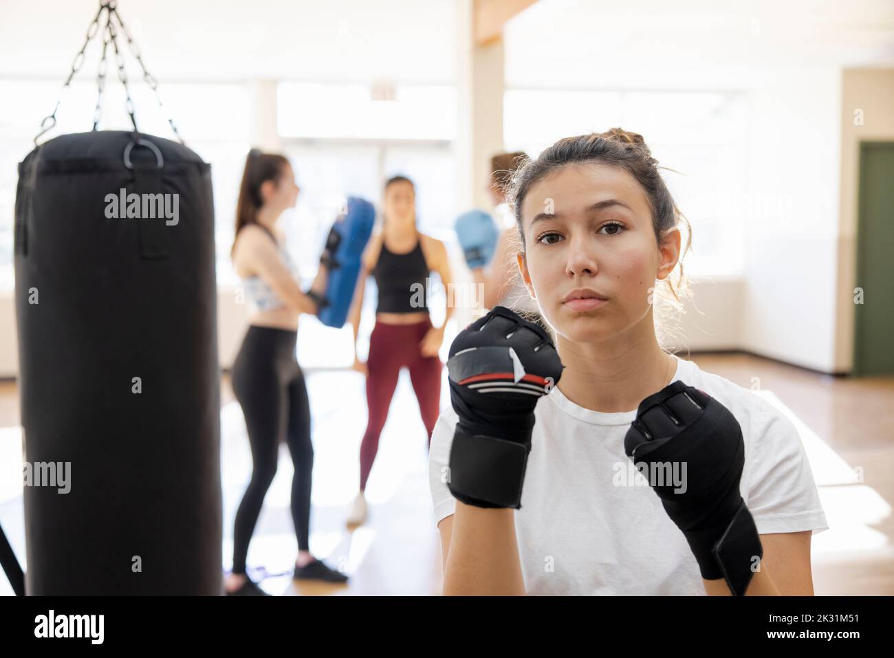 Portrait confident tough teen girl boxing in gym studio Stock Photo - Alamy