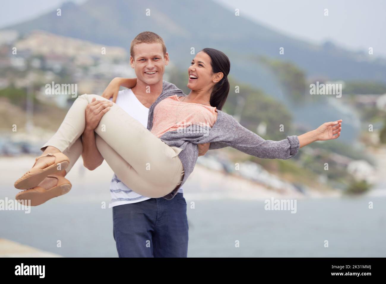 Ill carry her to the ends of the earth. a handsome young man carrying ...